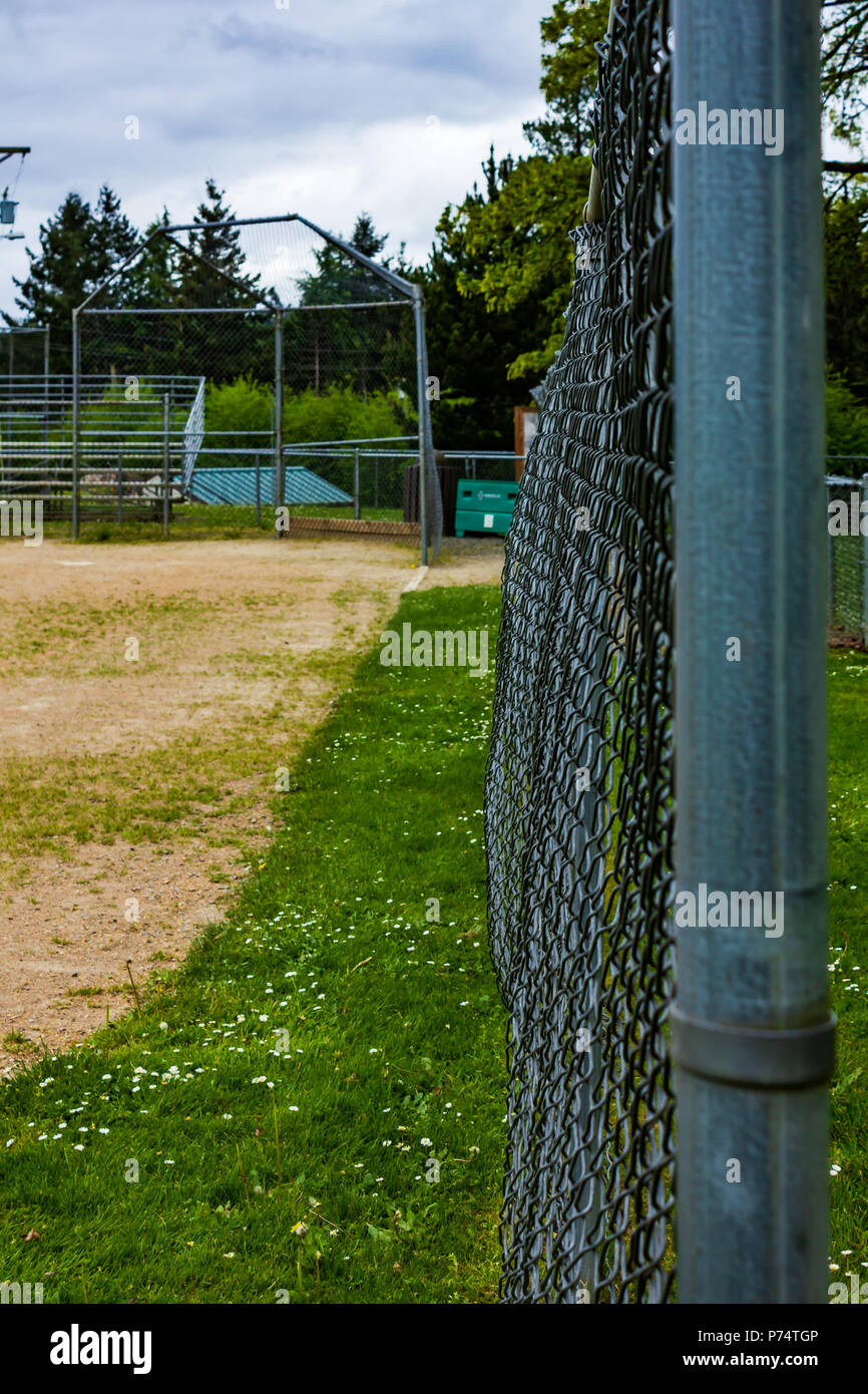 fencing along baseball diamond at park Stock Photo - Alamy