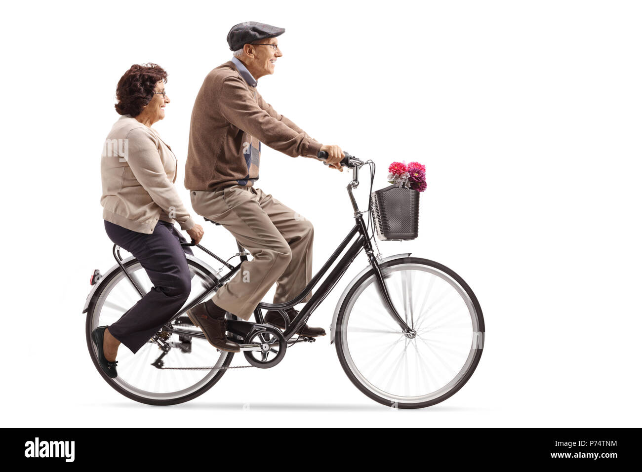 Seniors riding a bicycle together isolated on white background Stock ...
