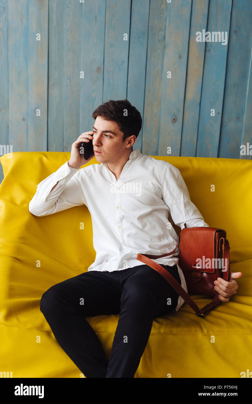 handsome guy with leather bag Stock Photo - Alamy