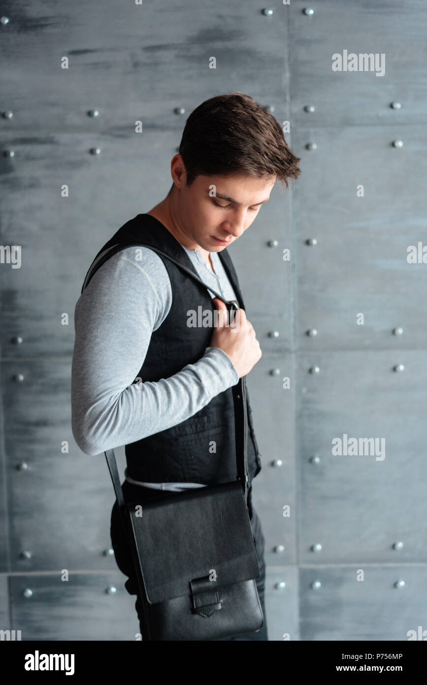 Handsome guy leather bag hi-res stock photography and images - Alamy