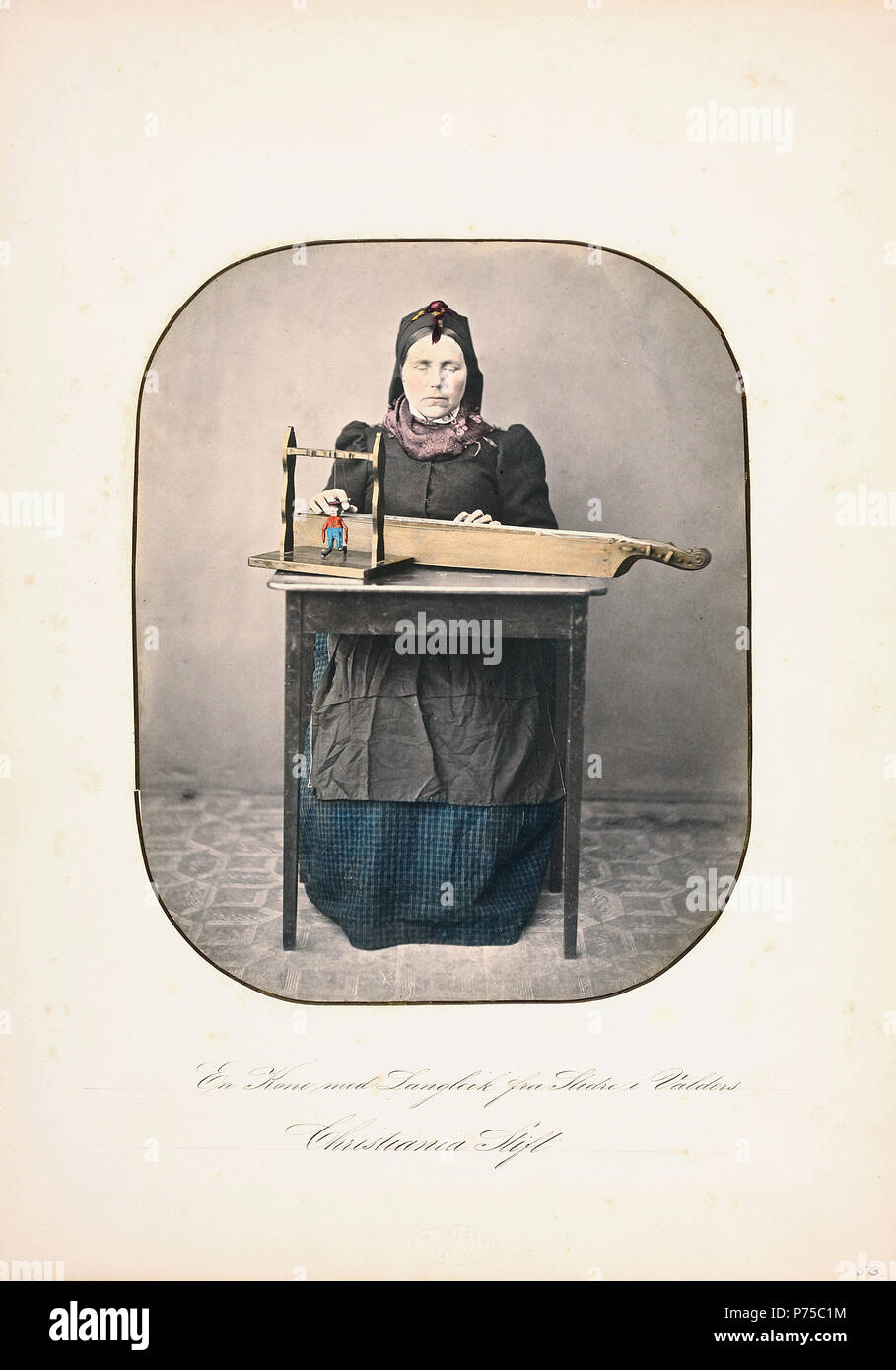 Marcus Selmer - A woman sitting by the table With a langleik in front ...