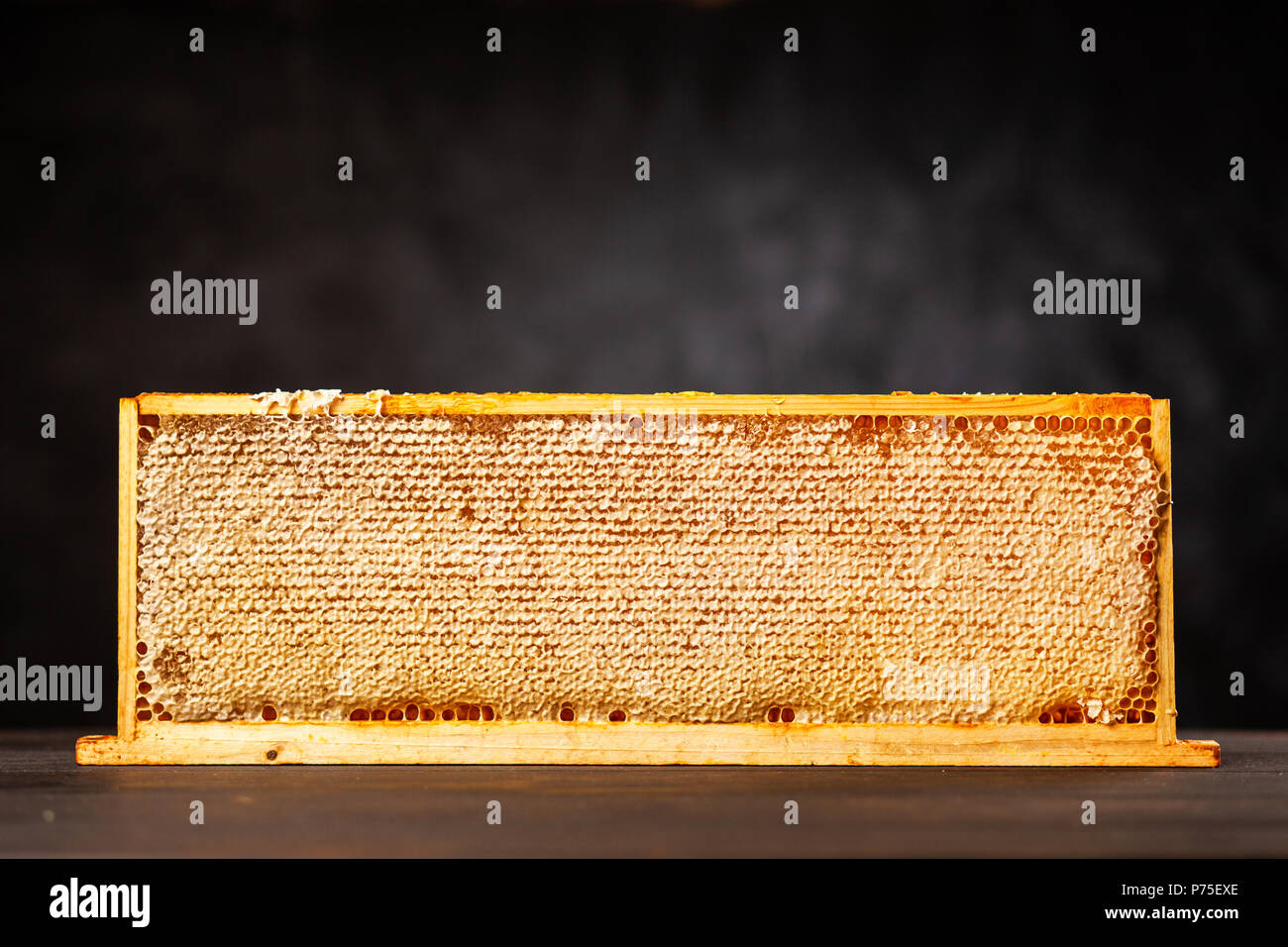 Honeycomb in a wooden frame Stock Photo - Alamy