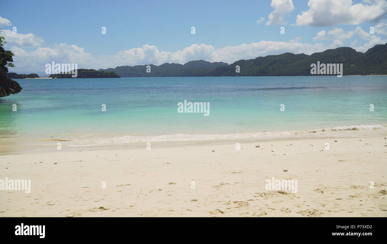 Sand beach and turquoise water, Matukad island, Caramoan, Philippines ...