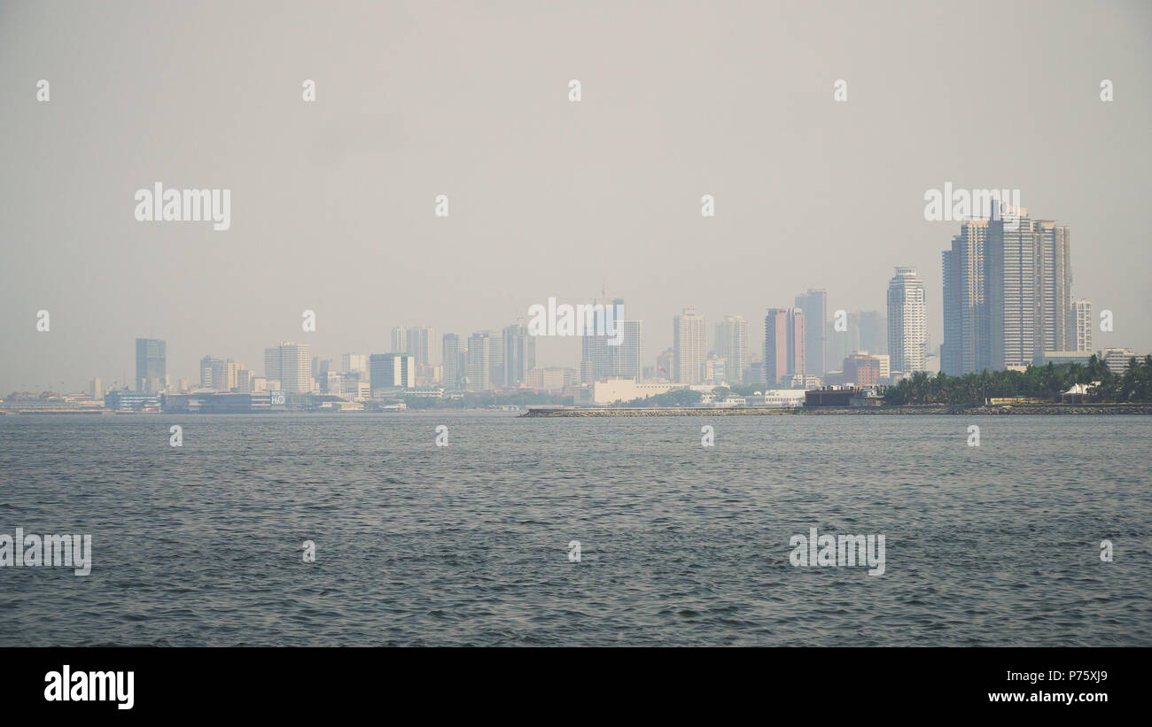 Panorama Manila city, skyscrapers and buildings. Seascape coastal city ...