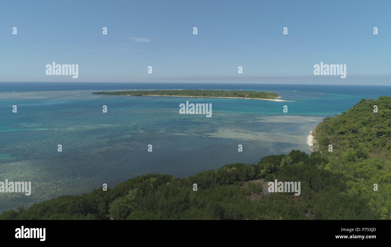 Tropical island with white sandy beach. Aerial view: Magalawa island ...