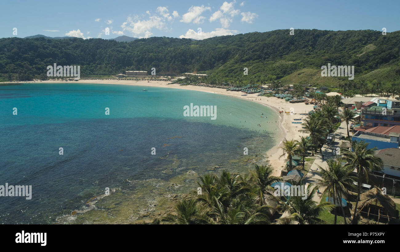 Aerial view of beautiful tropical beach with turquoise water in blue ...
