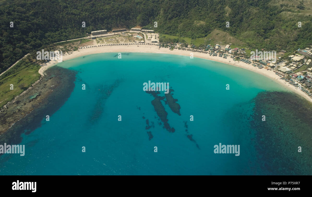 Aerial view of beautiful tropical beach with turquoise water in blue ...