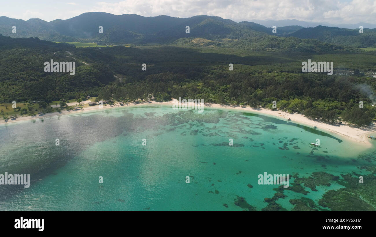 Aerial view of beautiful tropical beach with turquoise water in blue ...