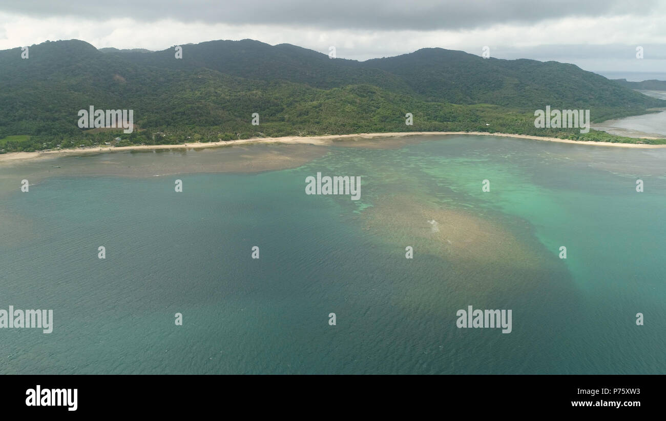 Aerial view of beautiful tropical beach with turquoise water in blue ...