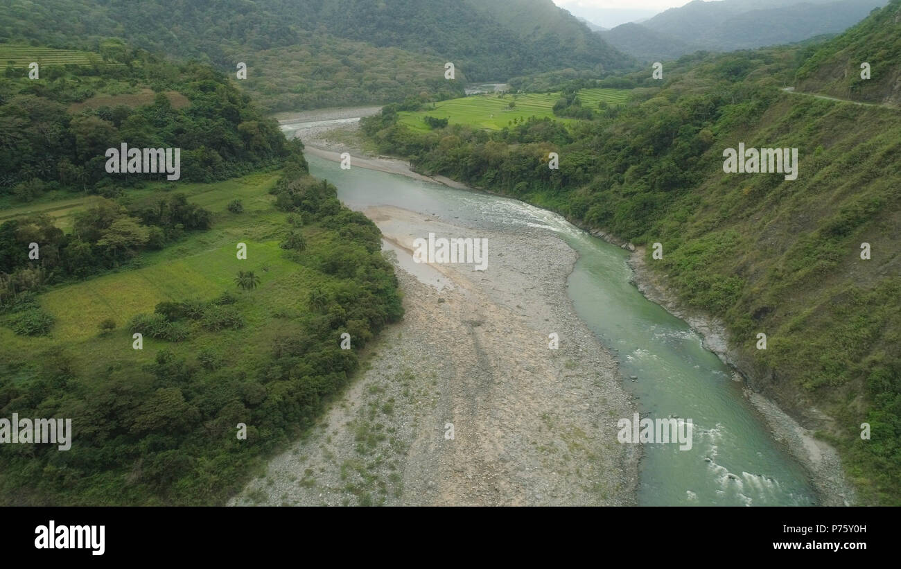 Aerial view of mountain valley in the cordillera, river, rice terraces ...