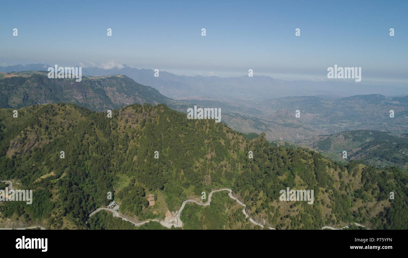 Aerial view of mountains covered forest, trees in clouds. Cordillera ...