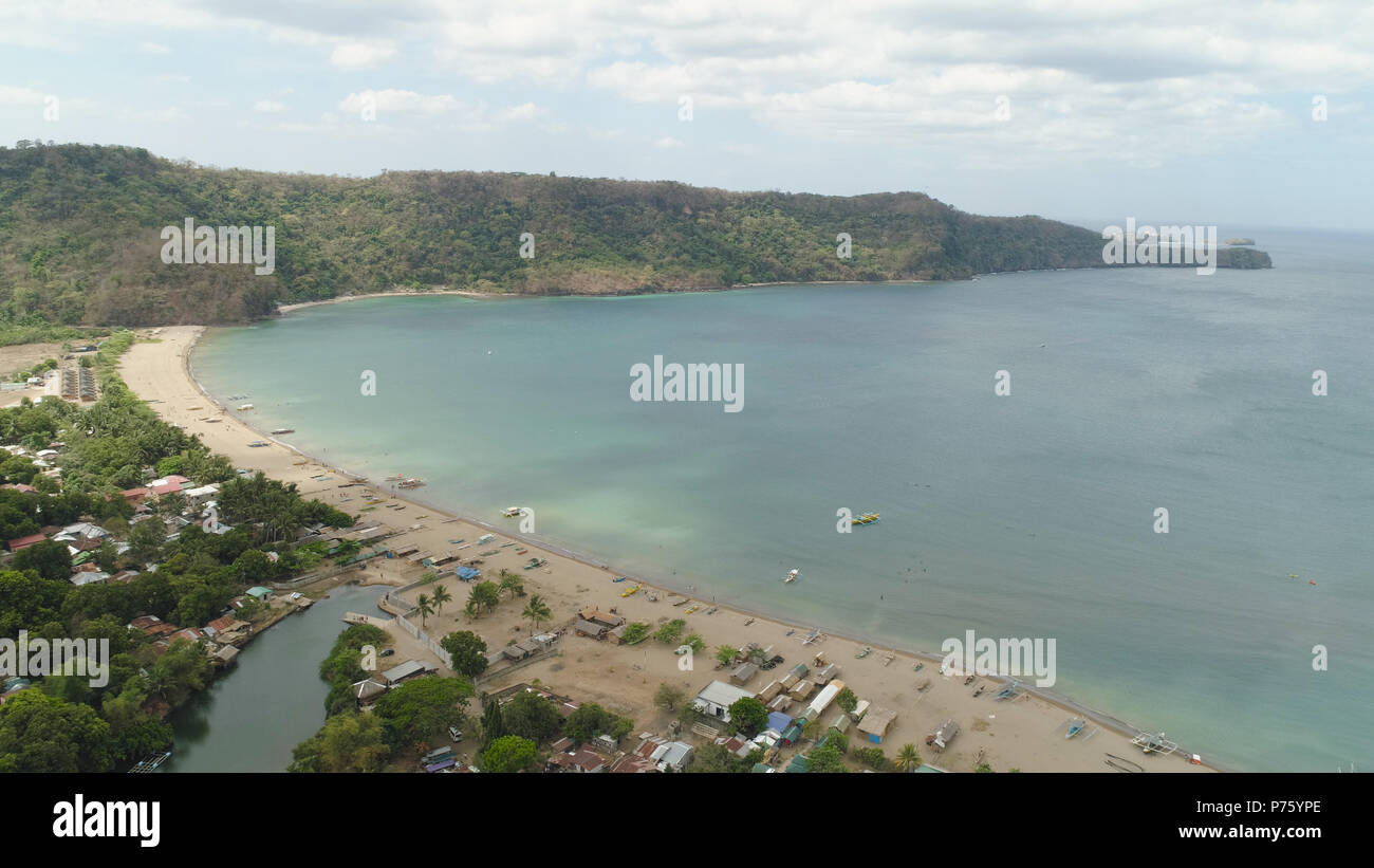 Aerial view of coast with beach in blue lagoon. Philippines, Luzon ...