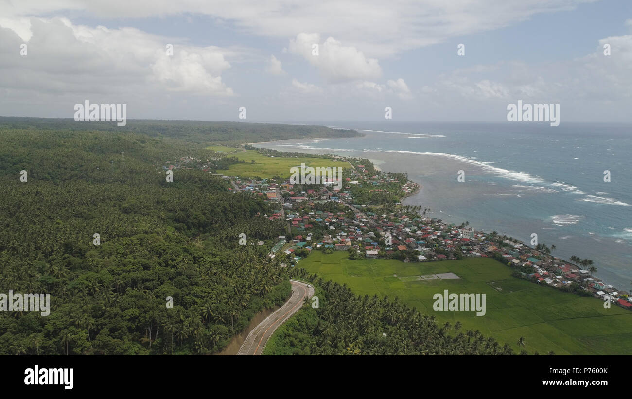 Aerial view of seashore with coastal town, beach, lagoons and coral ...