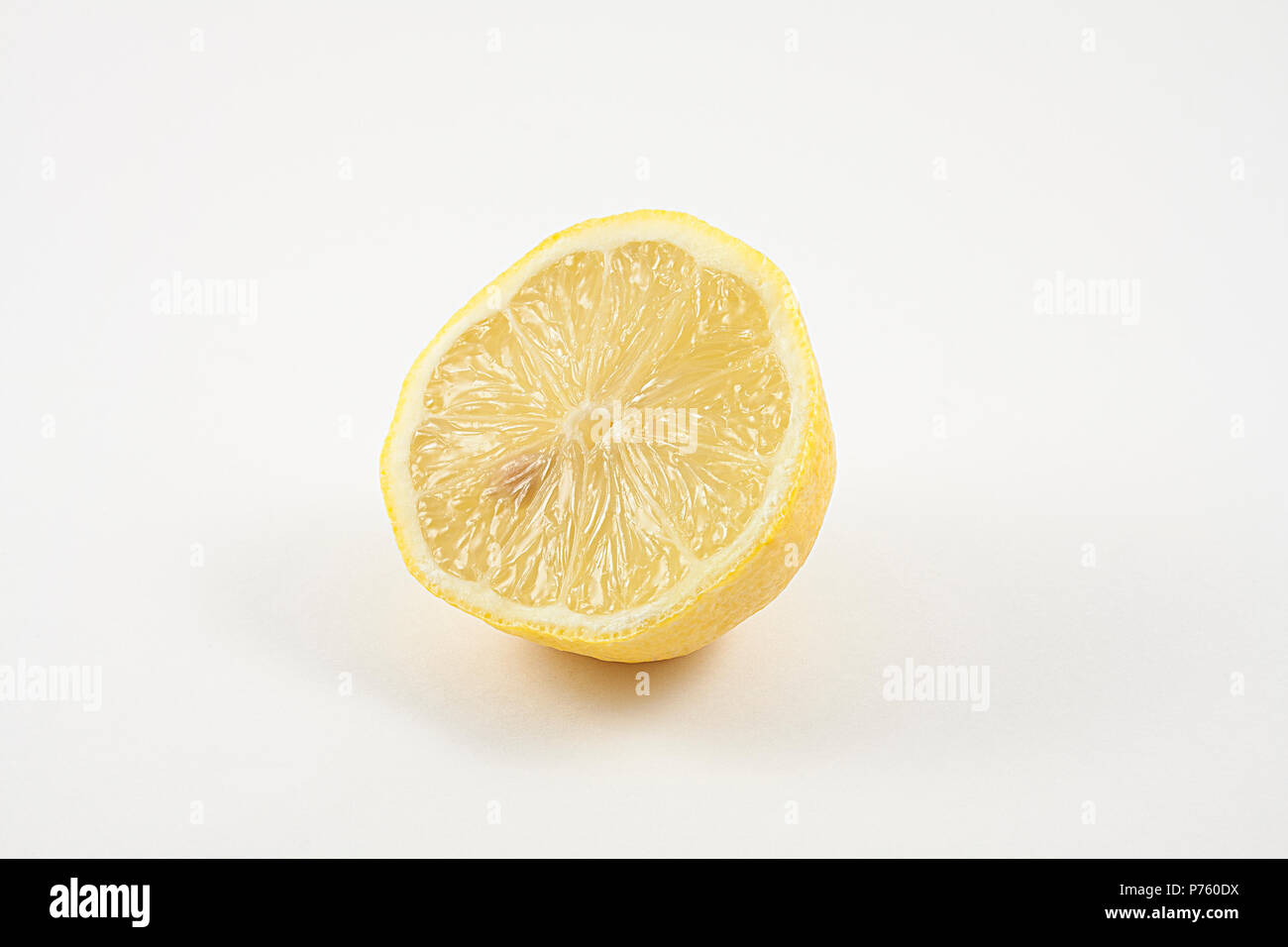 lemon cut in half isolated on white background Stock Photo - Alamy