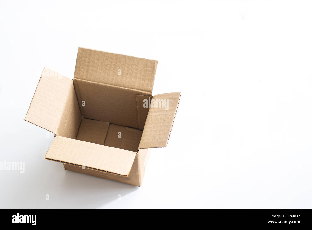 Empty carboard box isolated against a bright white backdrop Stock Photo ...