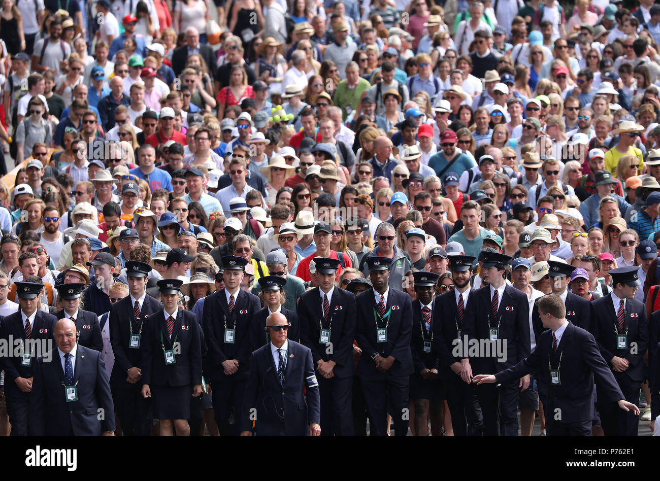 Spectators are led into the grounds on day three of the Wimbledon ...