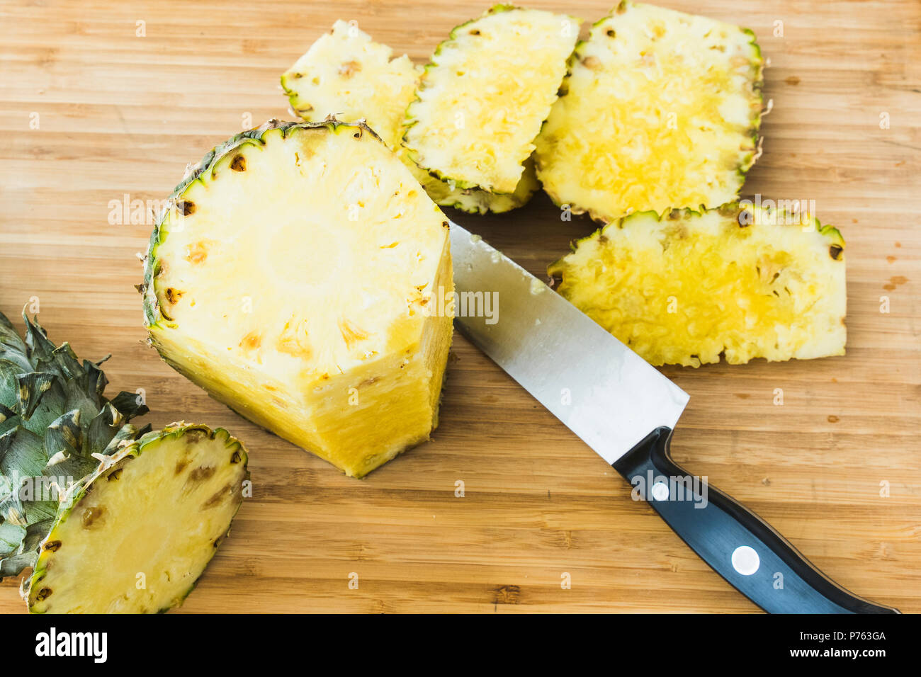 closeup cutting a natural pineapple on wooden background Stock Photo ...