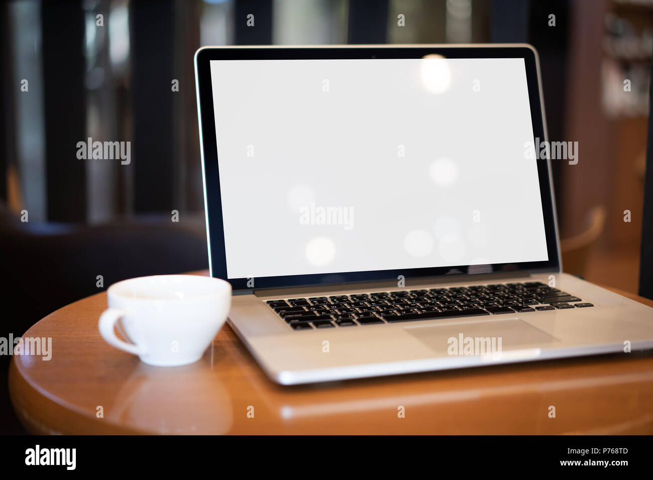 Laptop with blank screen on table. Workspace background new project on ...