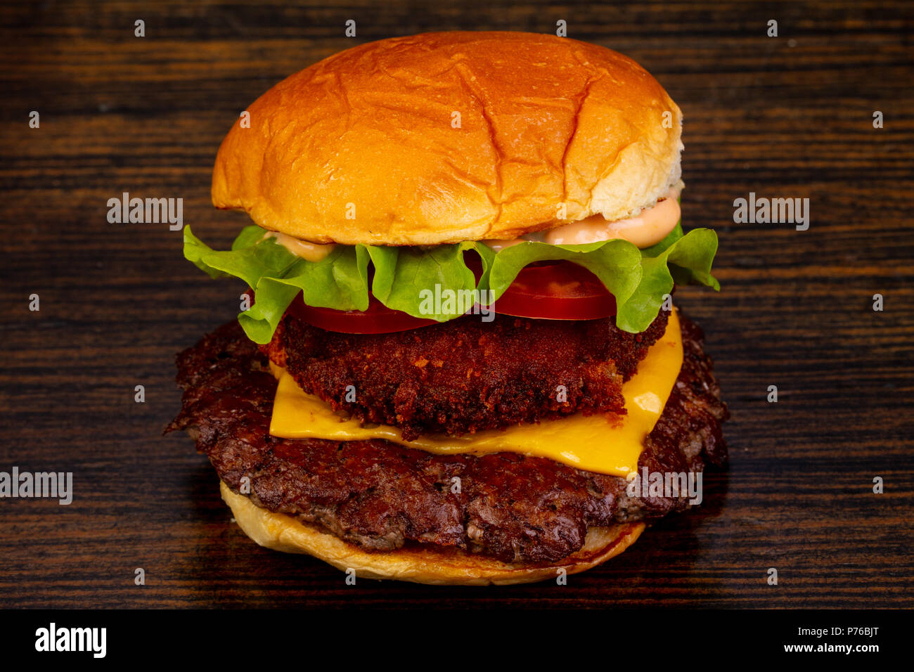 Tasty hot burger over wooden background Stock Photo - Alamy