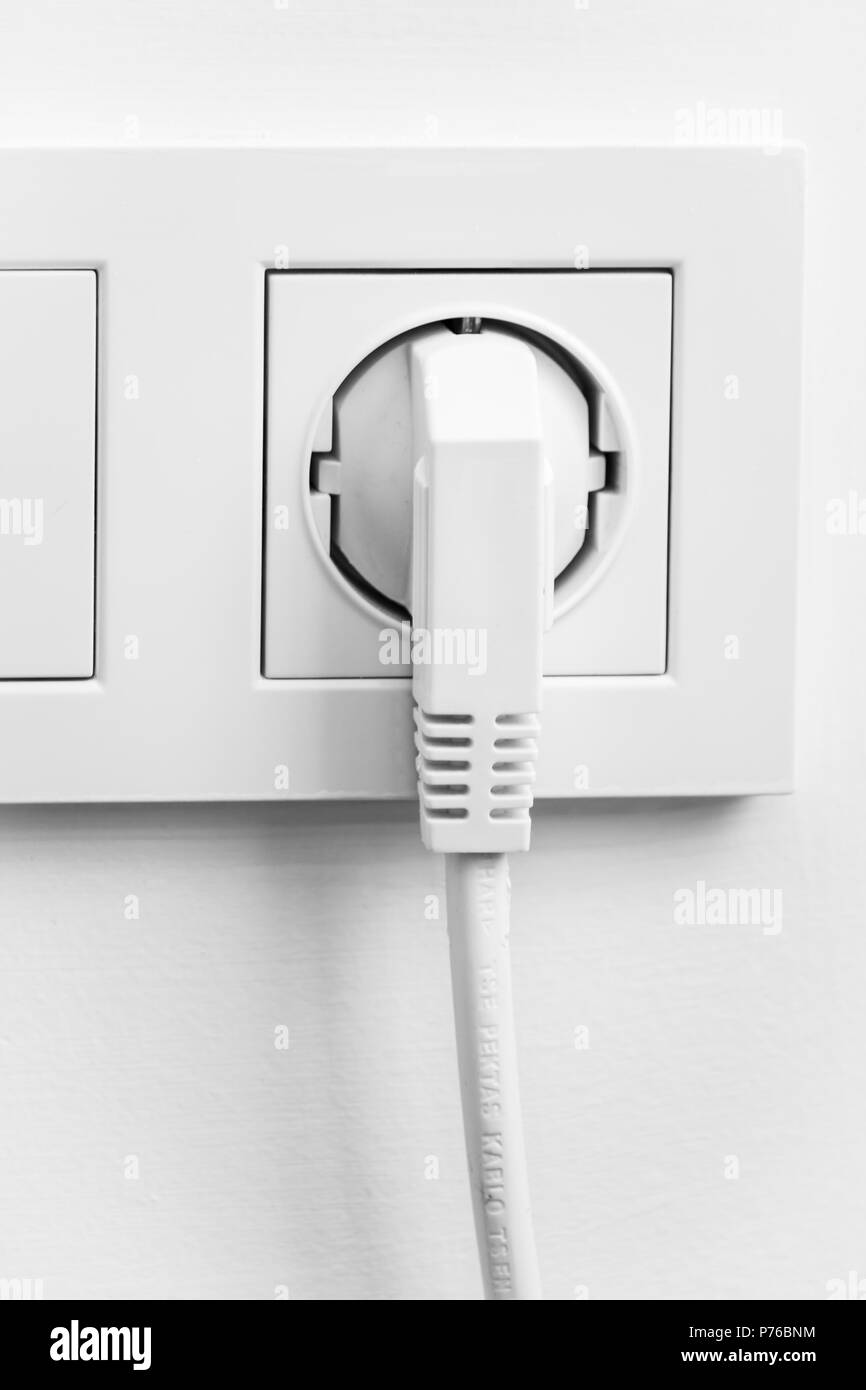 Electric plug at the wall Stock Photo - Alamy