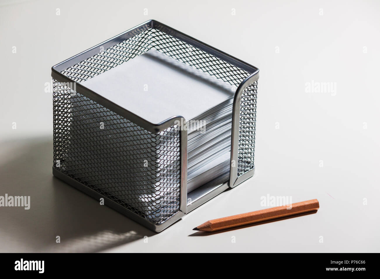 Note sheets in a metallic box and a pencil Stock Photo - Alamy