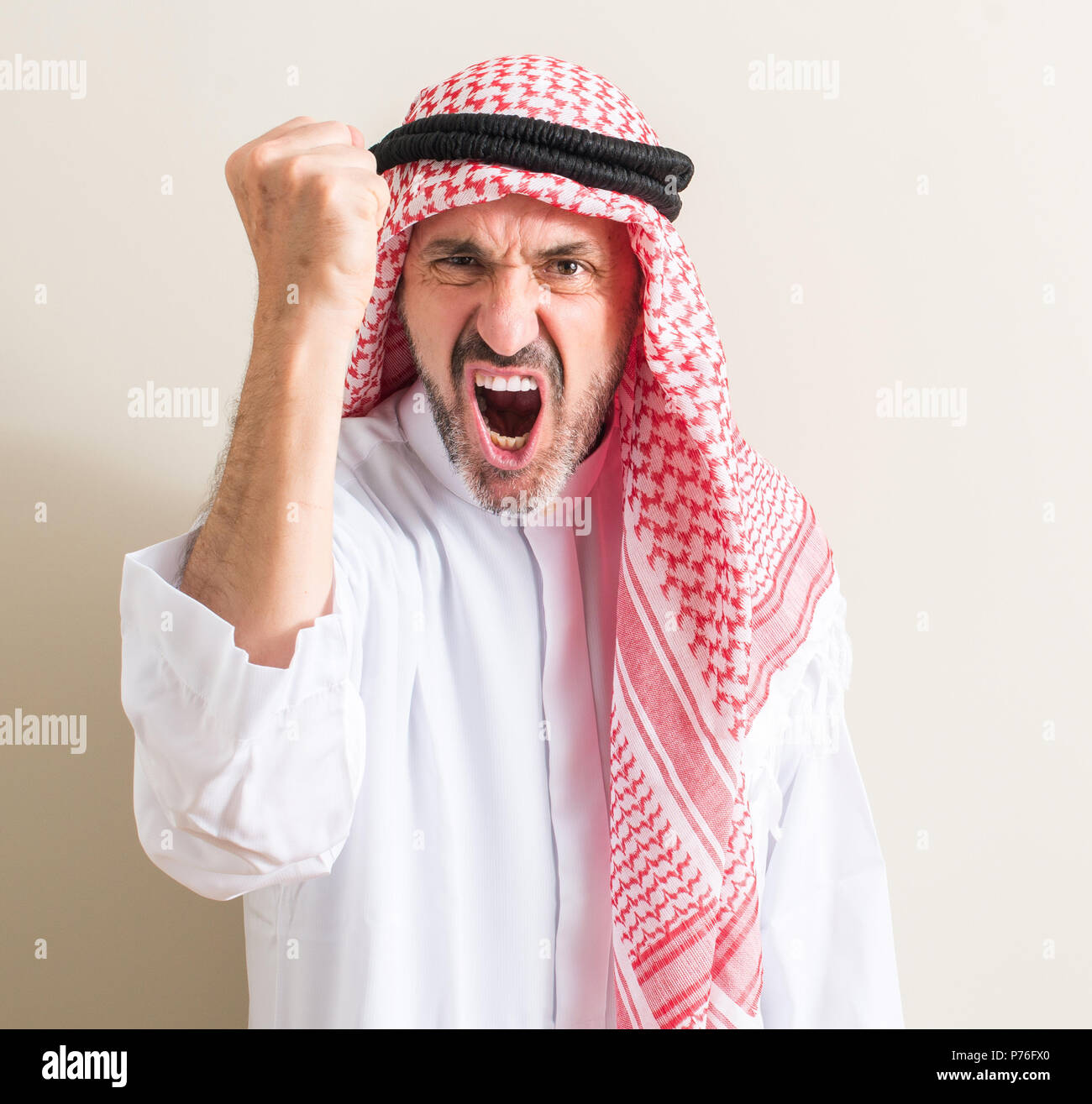 Senior arabic man annoyed and frustrated shouting with anger, crazy and ... Senior arabic man annoyed and frustrated shouting with anger, crazy and ...