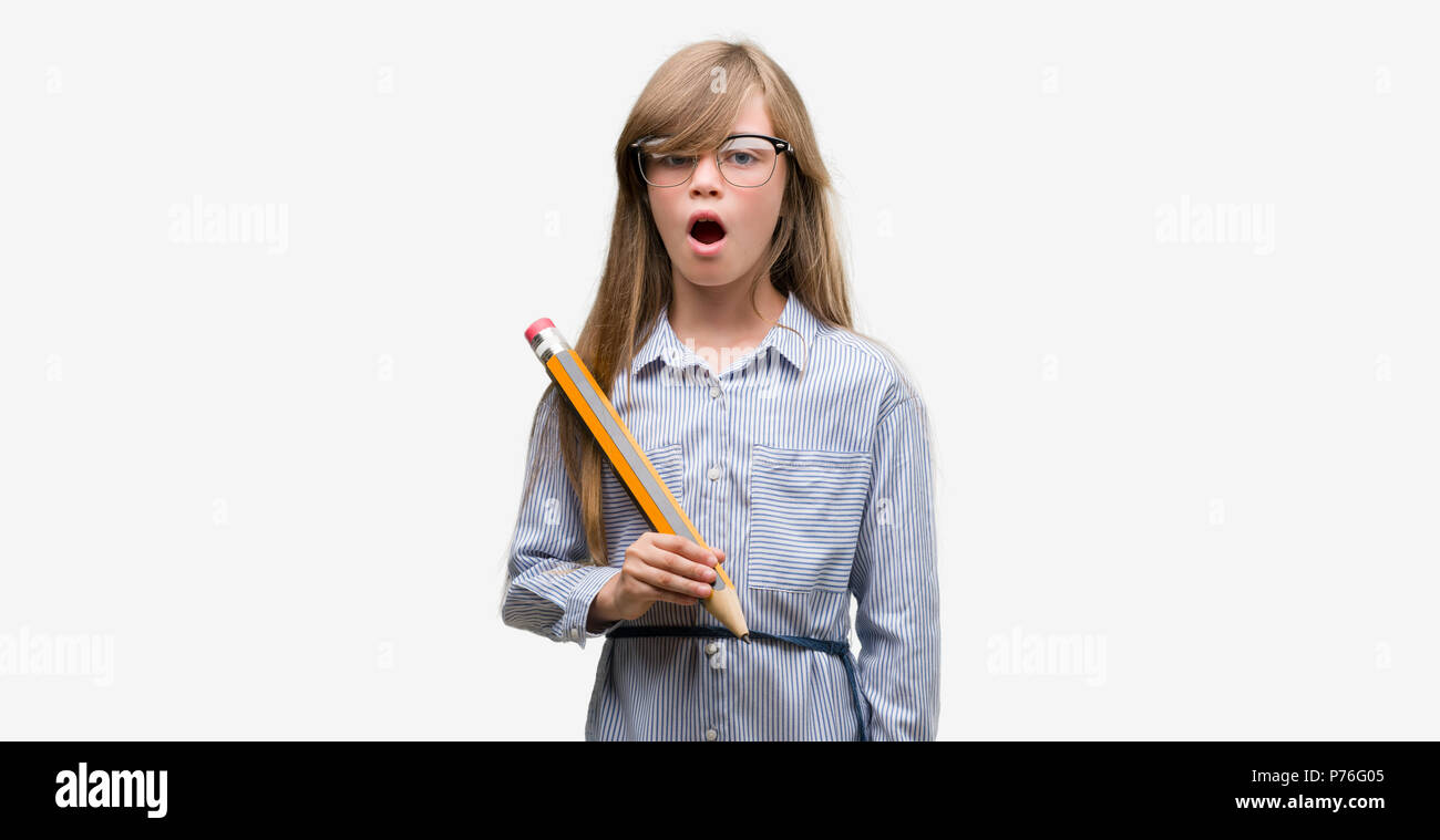 Holding a pencil in her mouth pencil in mouth hi-res stock photography ...