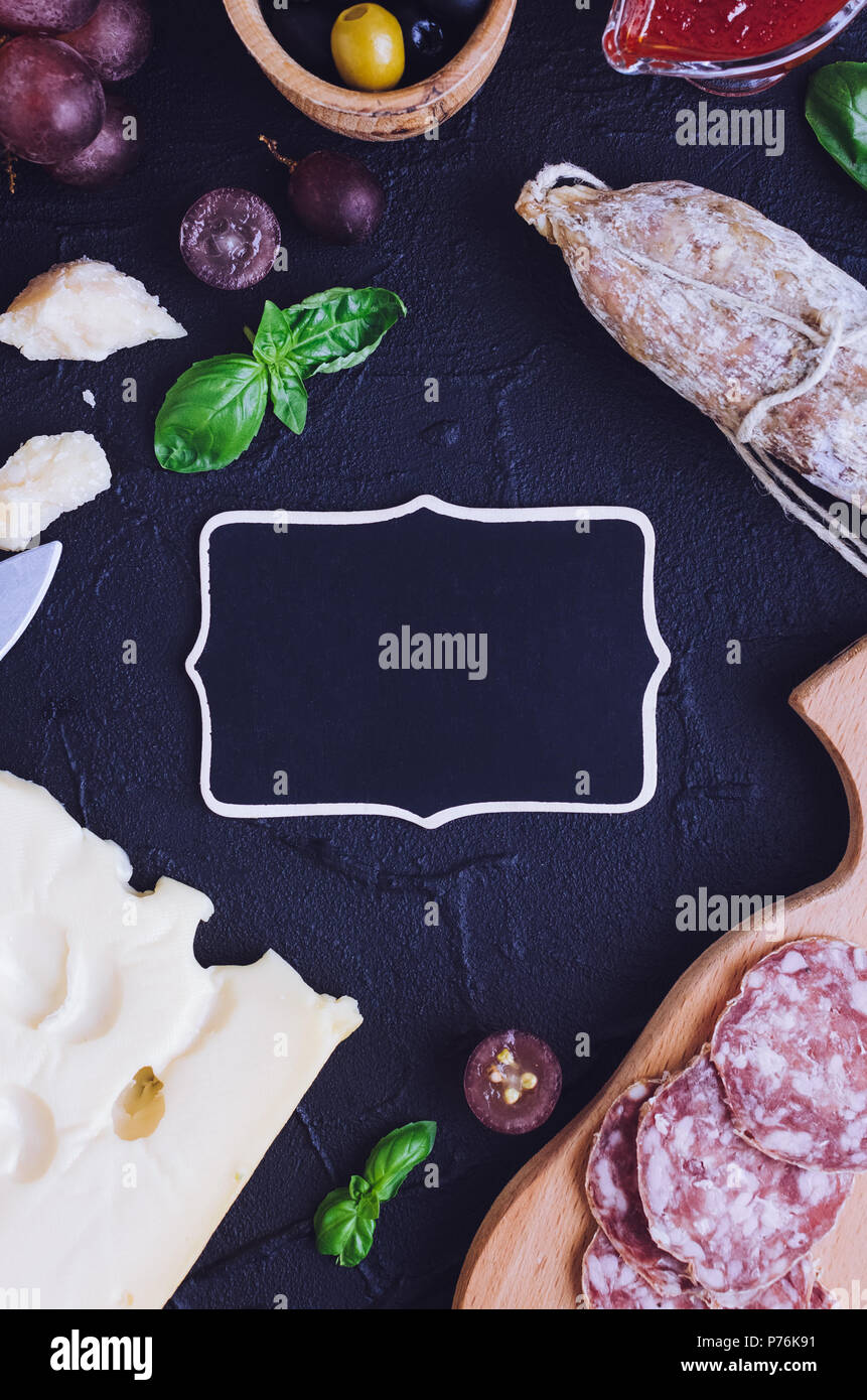 Table full of mediterranean appetizers, tapas or antipasti. Assorted ...