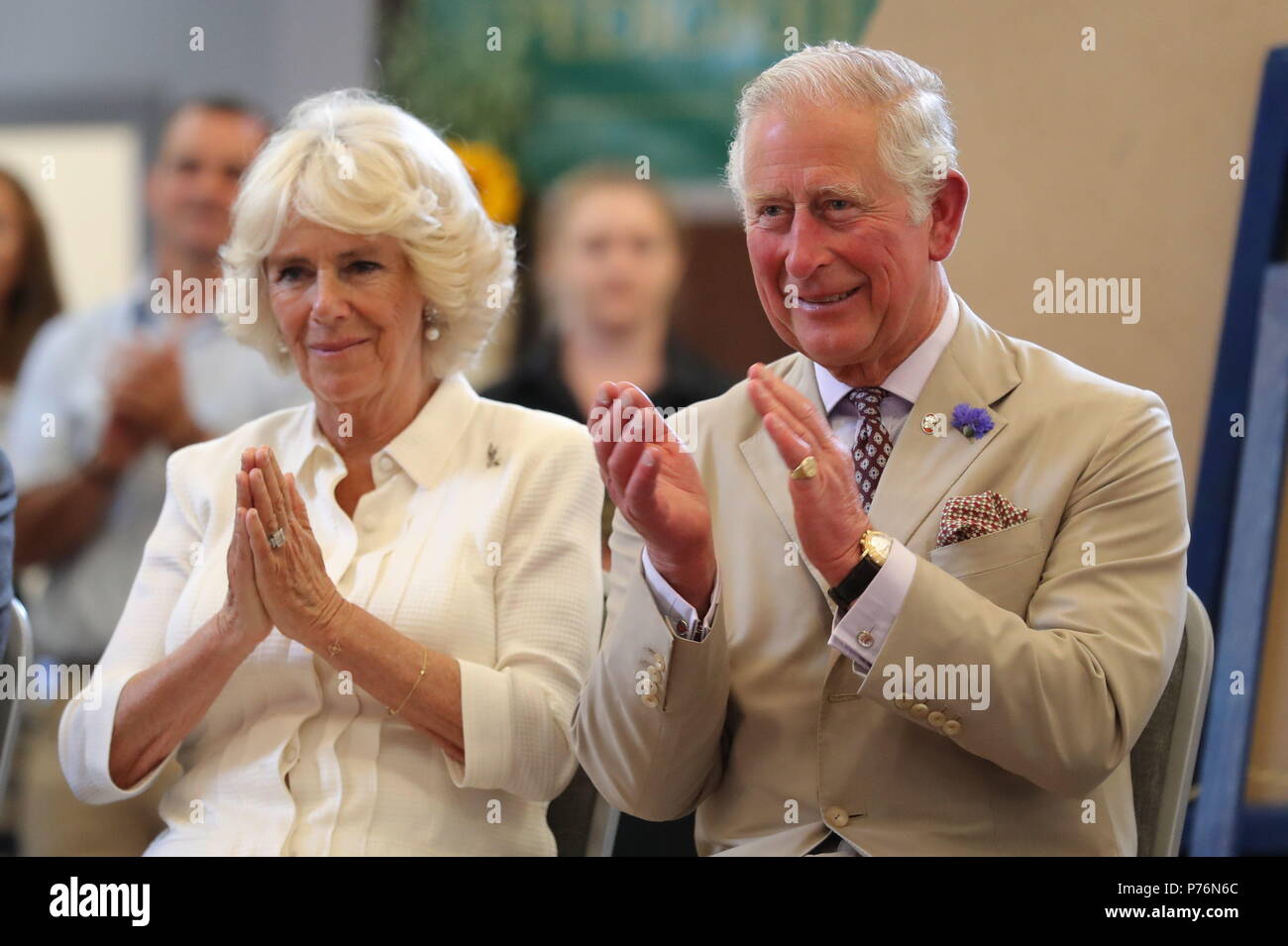The Prince of Wales and the Duchess of Cornwall claps as they watch a ...