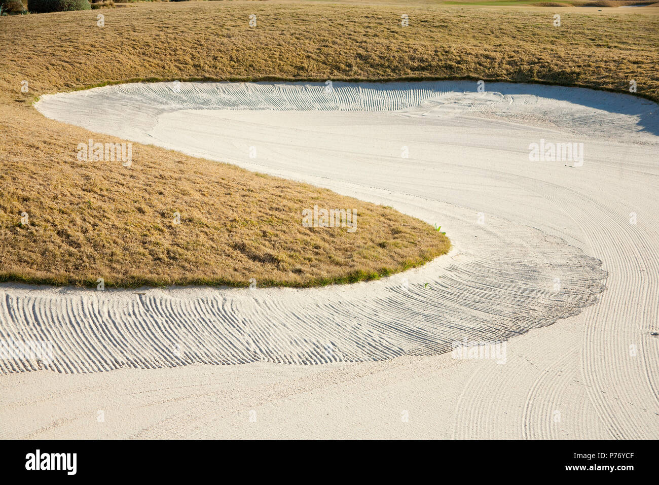 Close up of raked sand patterns in golf bunker - machine raked sand ...