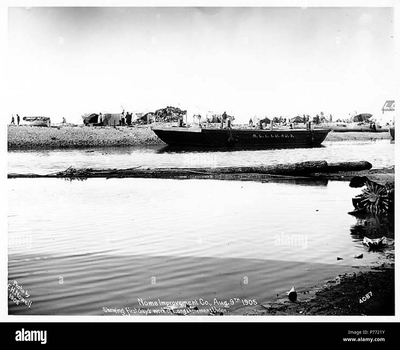 . English: Barge, tents and group of people on beach, Nome, August 1905 ...