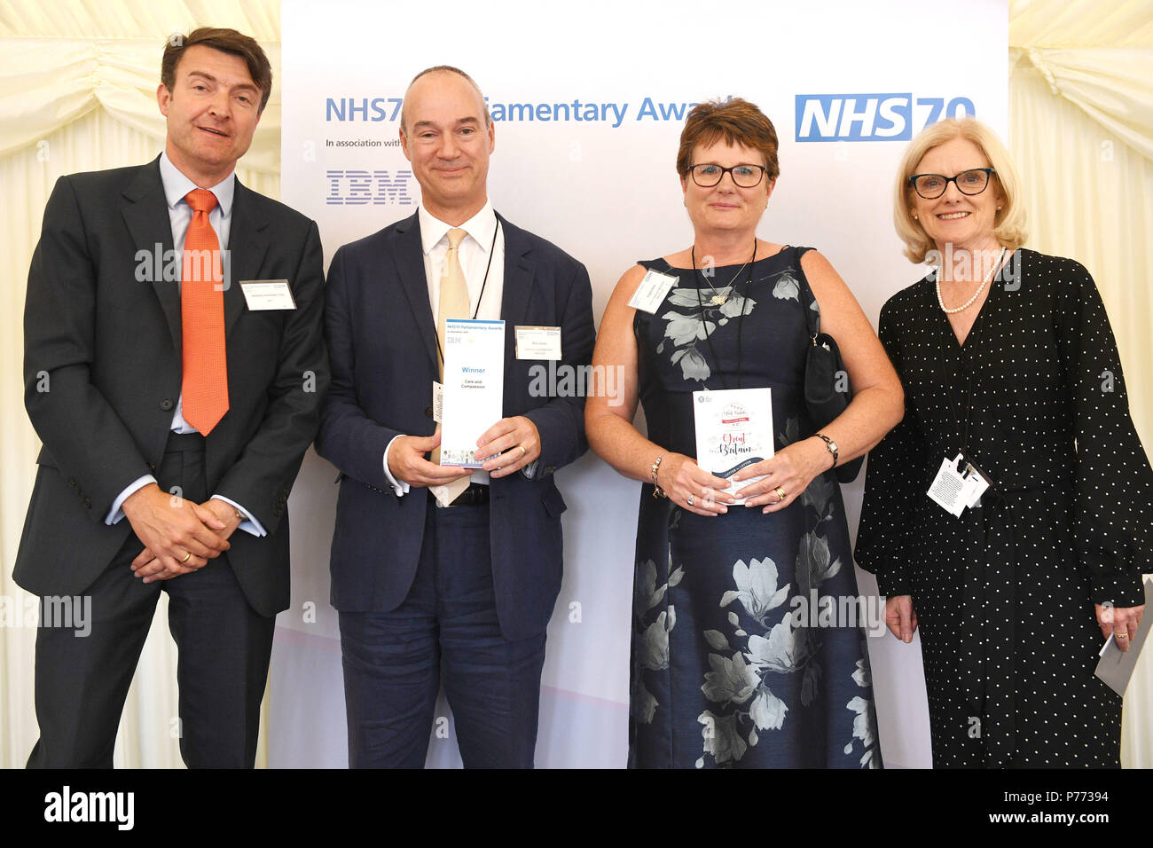 Angela Fenn (second right) and Nick Craver (second left) are given the ...