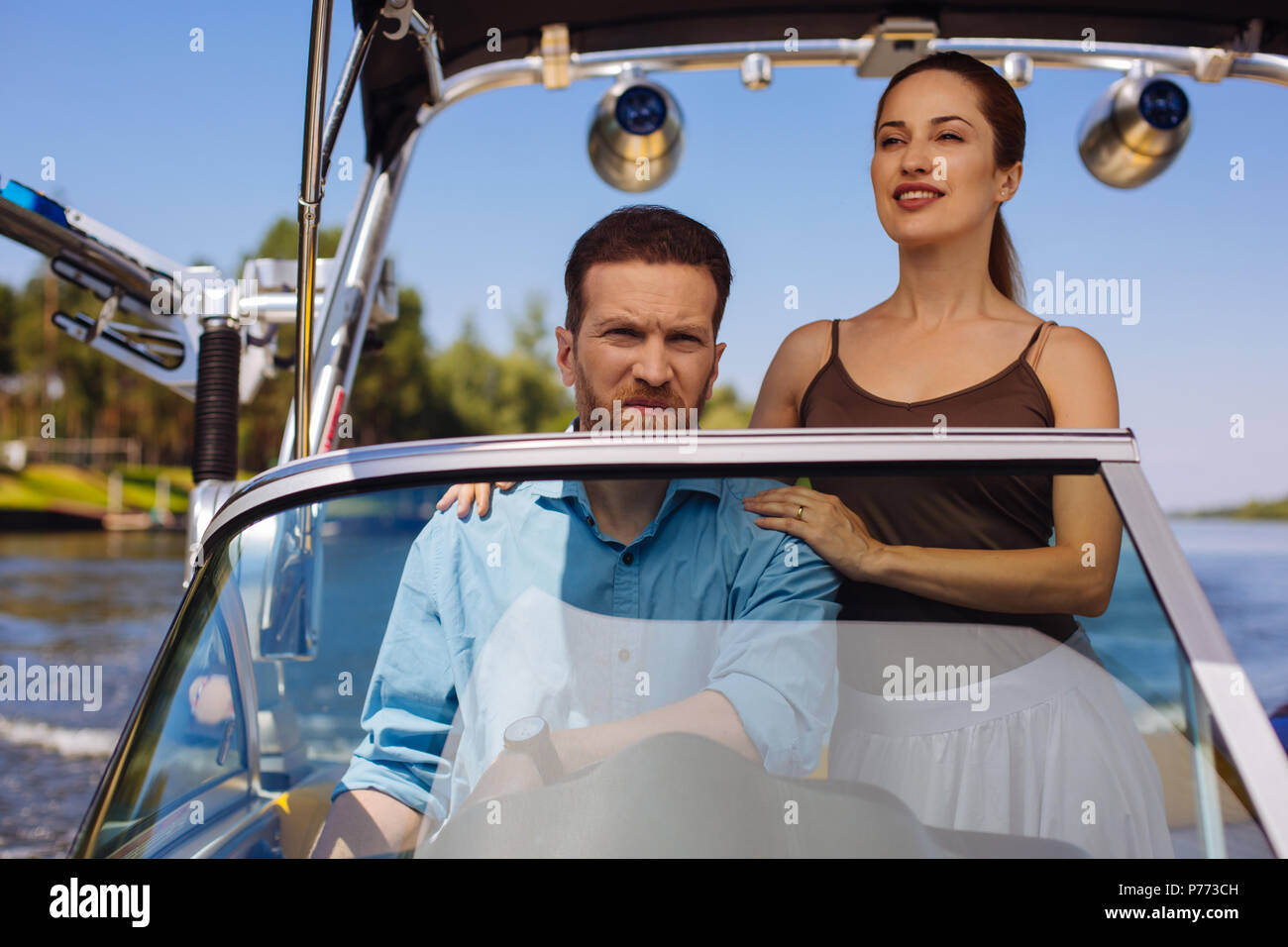 Pleasant young couple sailing a boat together Stock Photo - Alamy