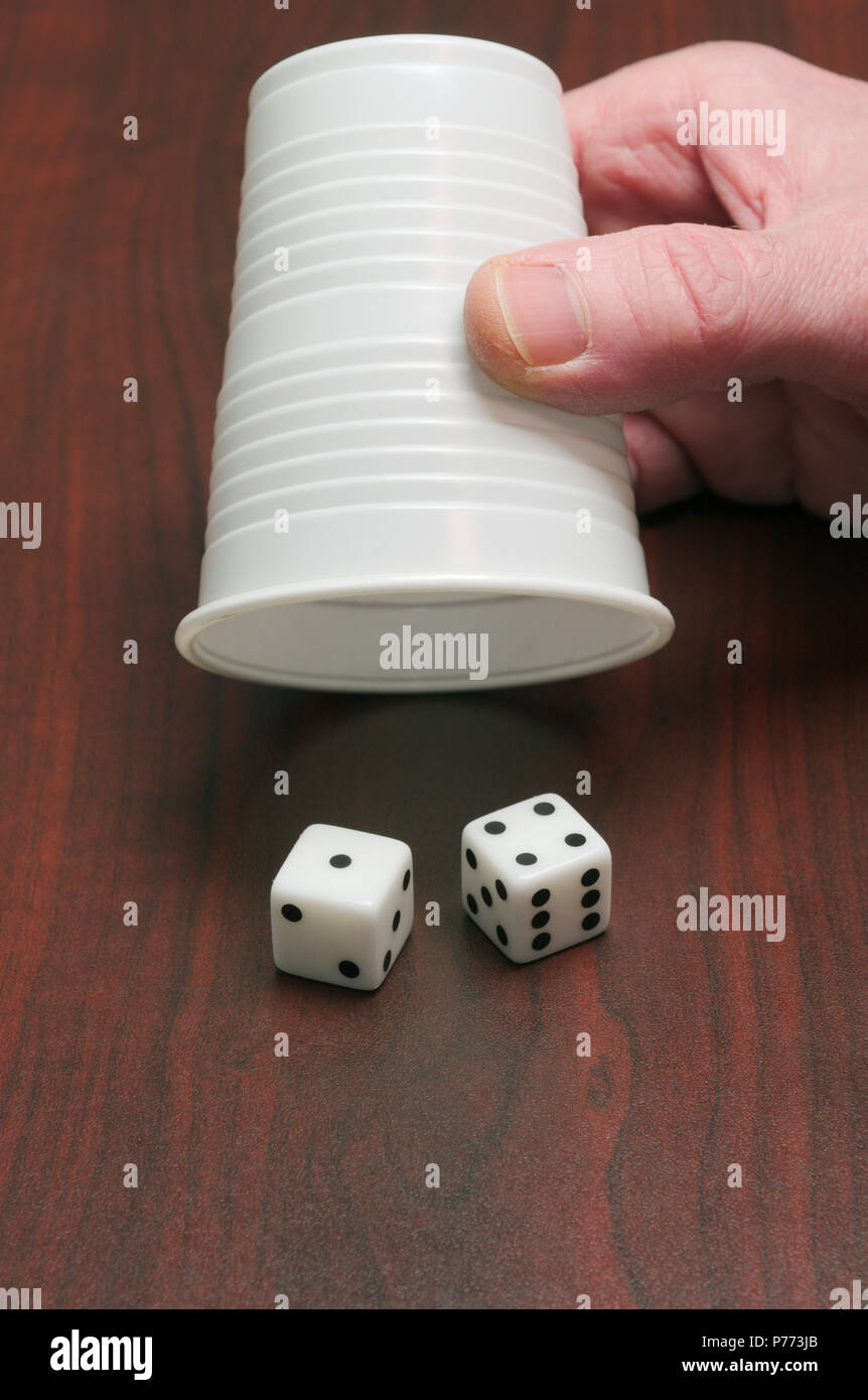 Hand throwing dice hi-res stock photography and images - Alamy