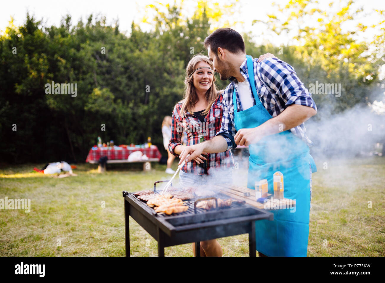 Family having barbecue hi-res stock photography and images - Alamy