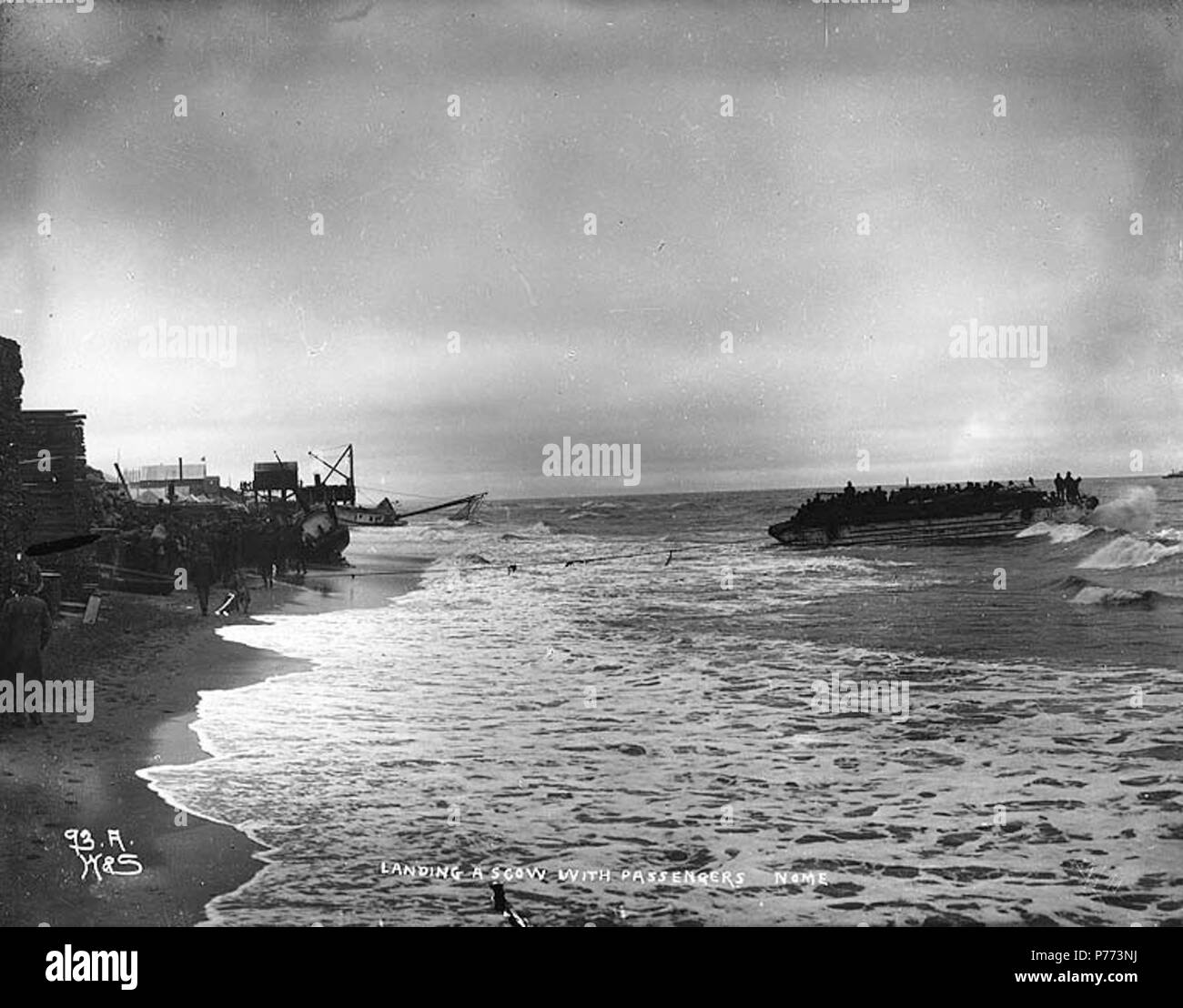 . English: Landing a scow with passengers on the beach at Nome, Alaska ...