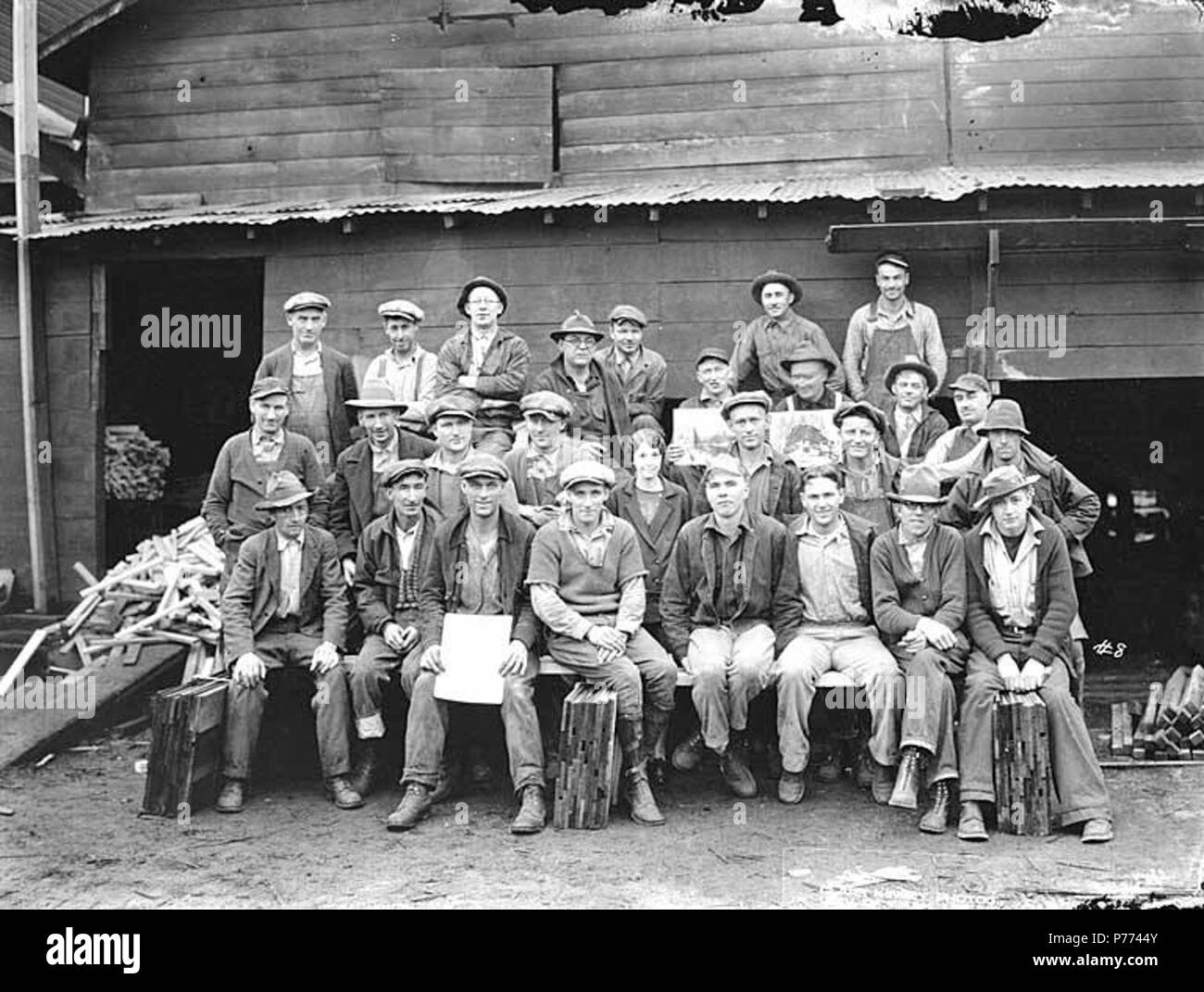 English: Logging crew and woman at camp, Wynooche Timber Company ...