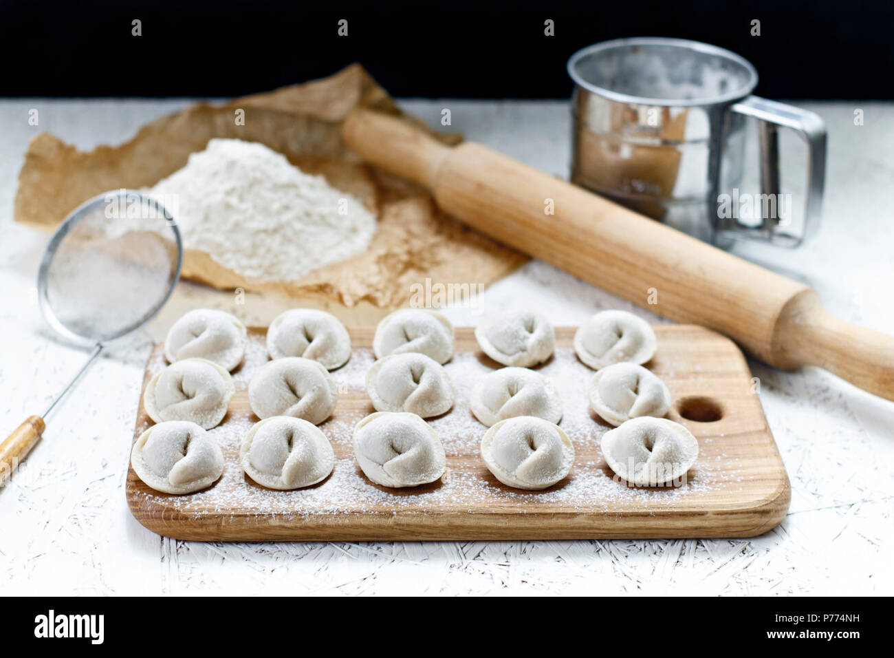 The process of making home-made dumplings. Raw homemade dumplings on a ...