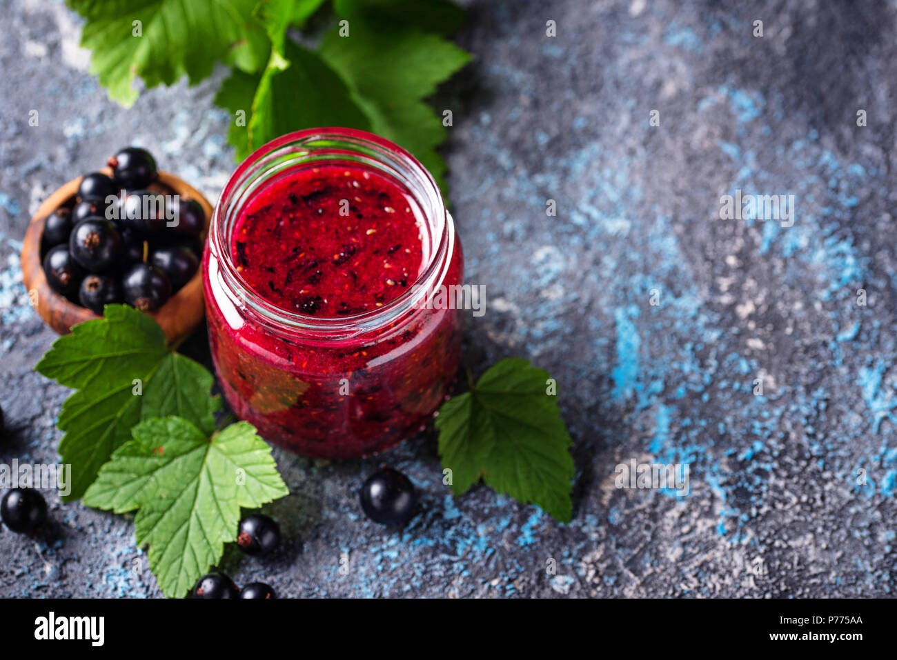 Black currant jam in jar Stock Photo - Alamy