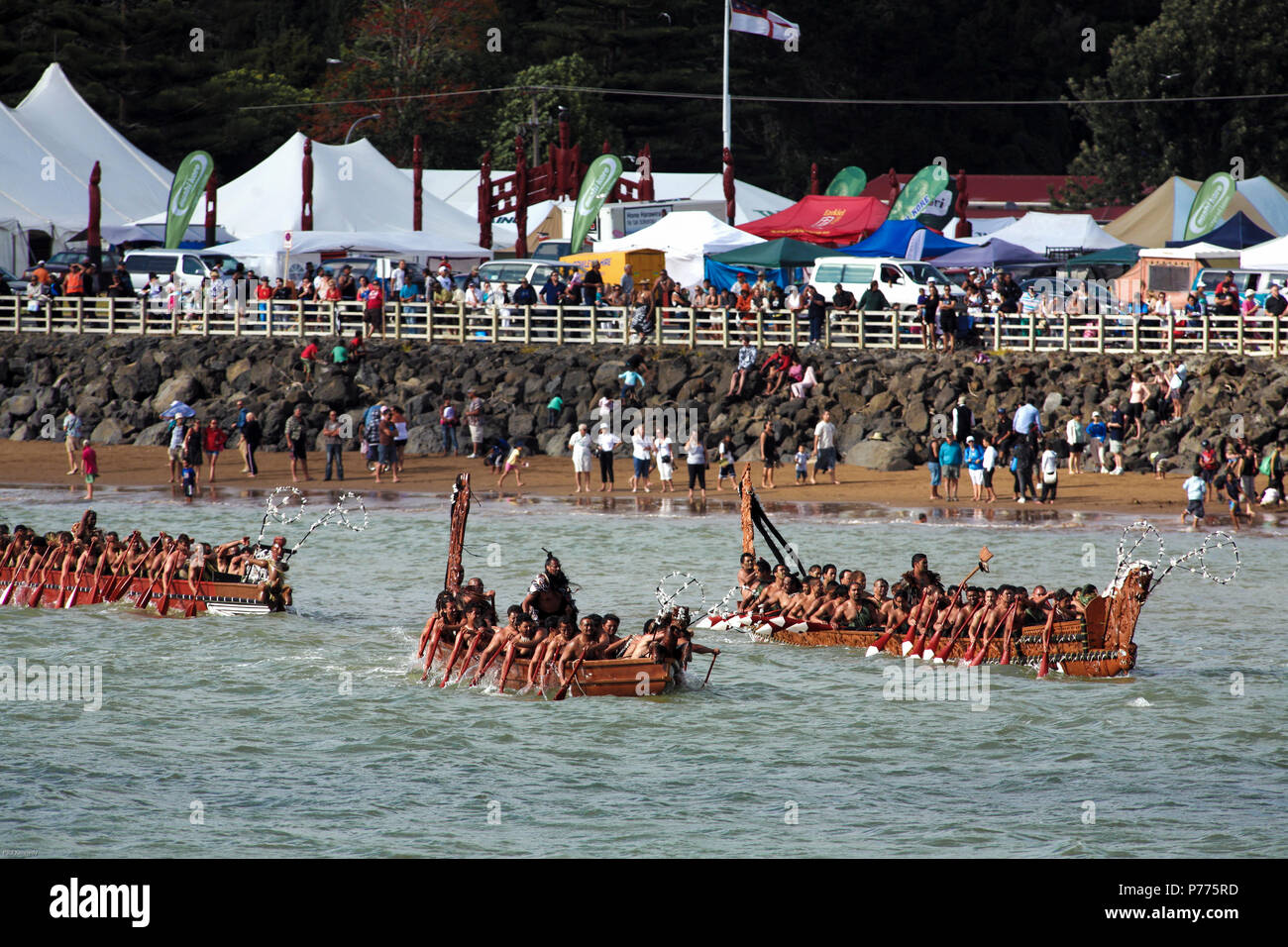 Maori warriors paddle Waka taua (war canoes) in Waitangi Day ...