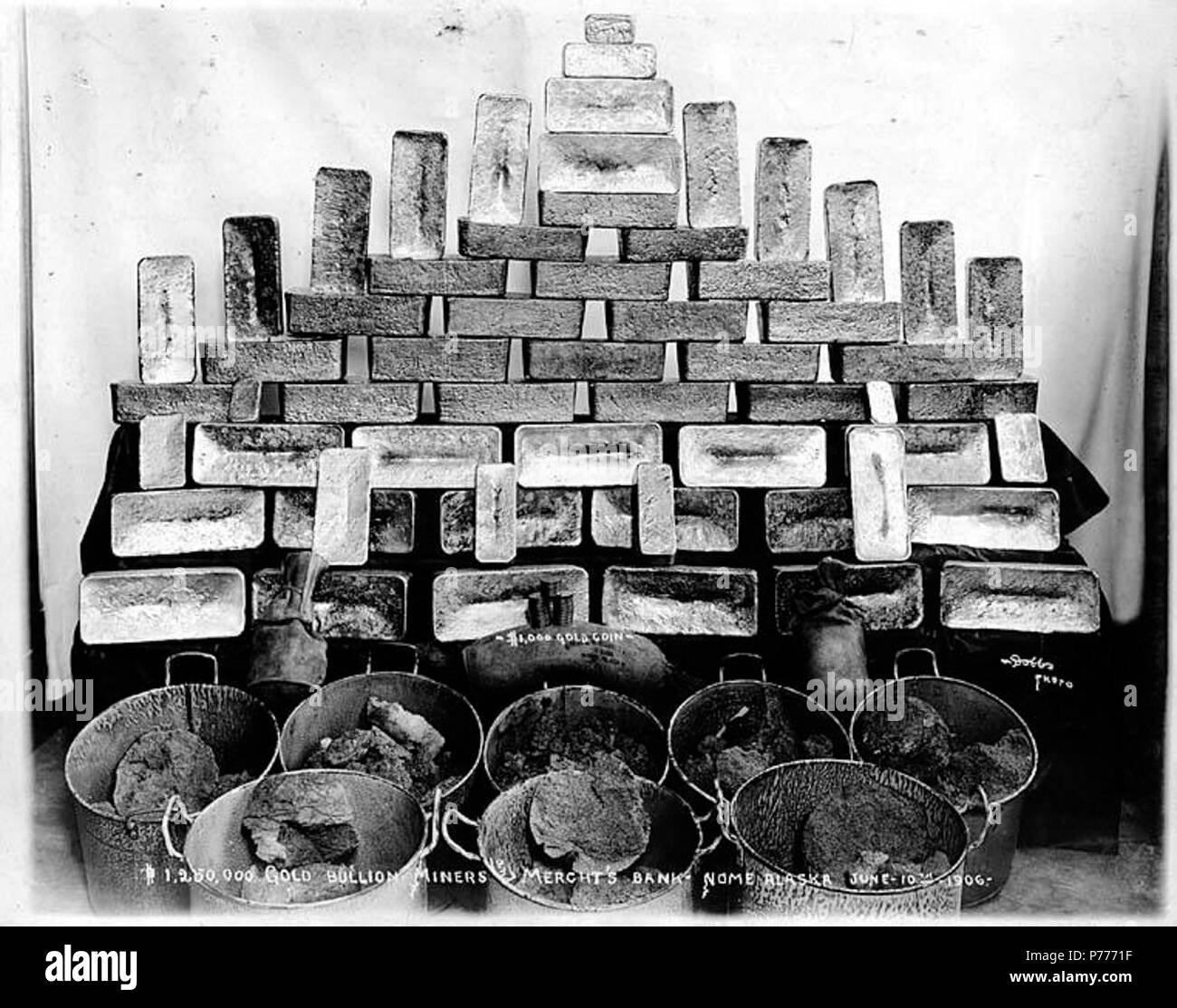 . English: Gold bricks and buckets of gold ore belonging to the Miner's ...