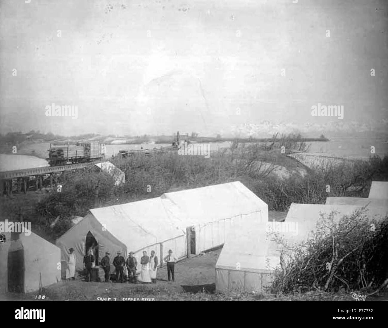 . English: Group of men including mess hall workers posing in front of ...