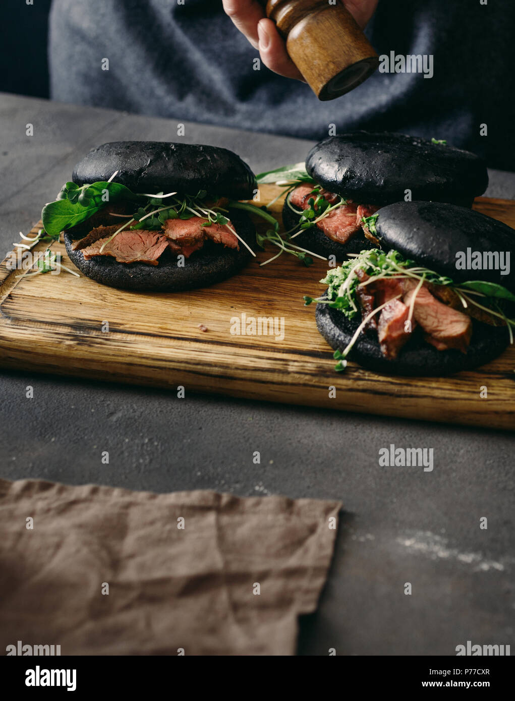 Barbecue cooking man burgers hi-res stock photography and images - Alamy