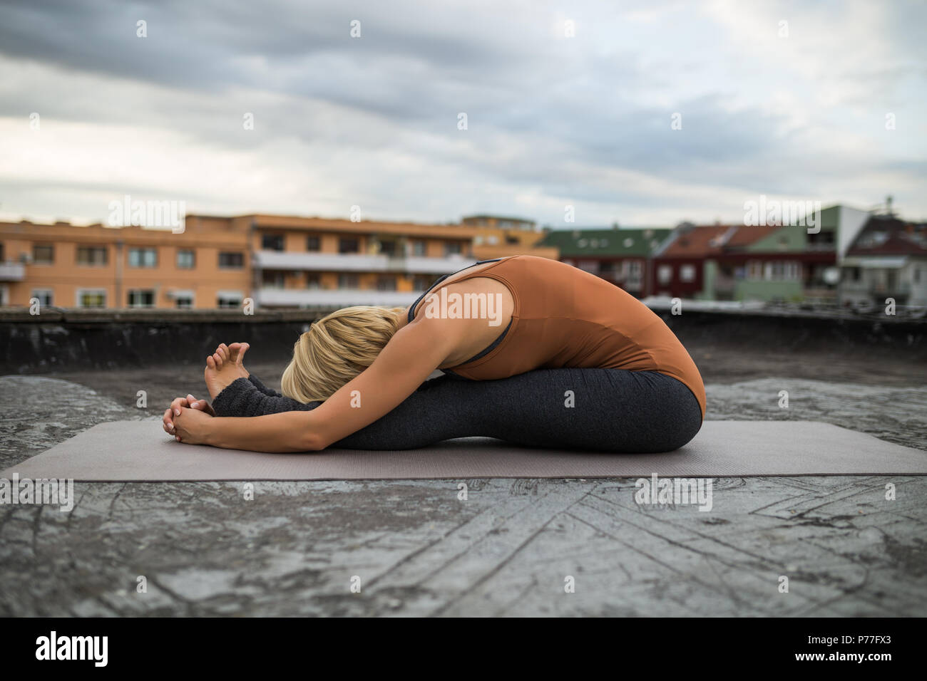Yoga-Paschimottanasana/Seated forward bend Stock Photo - Alamy