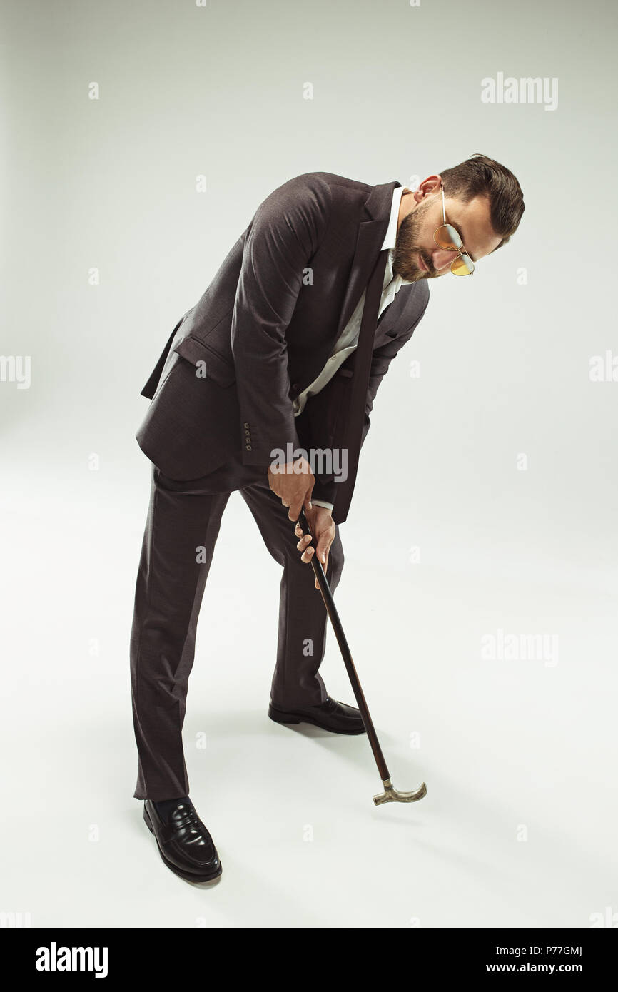 The barded man in a suit holding cane Stock Photo - Alamy