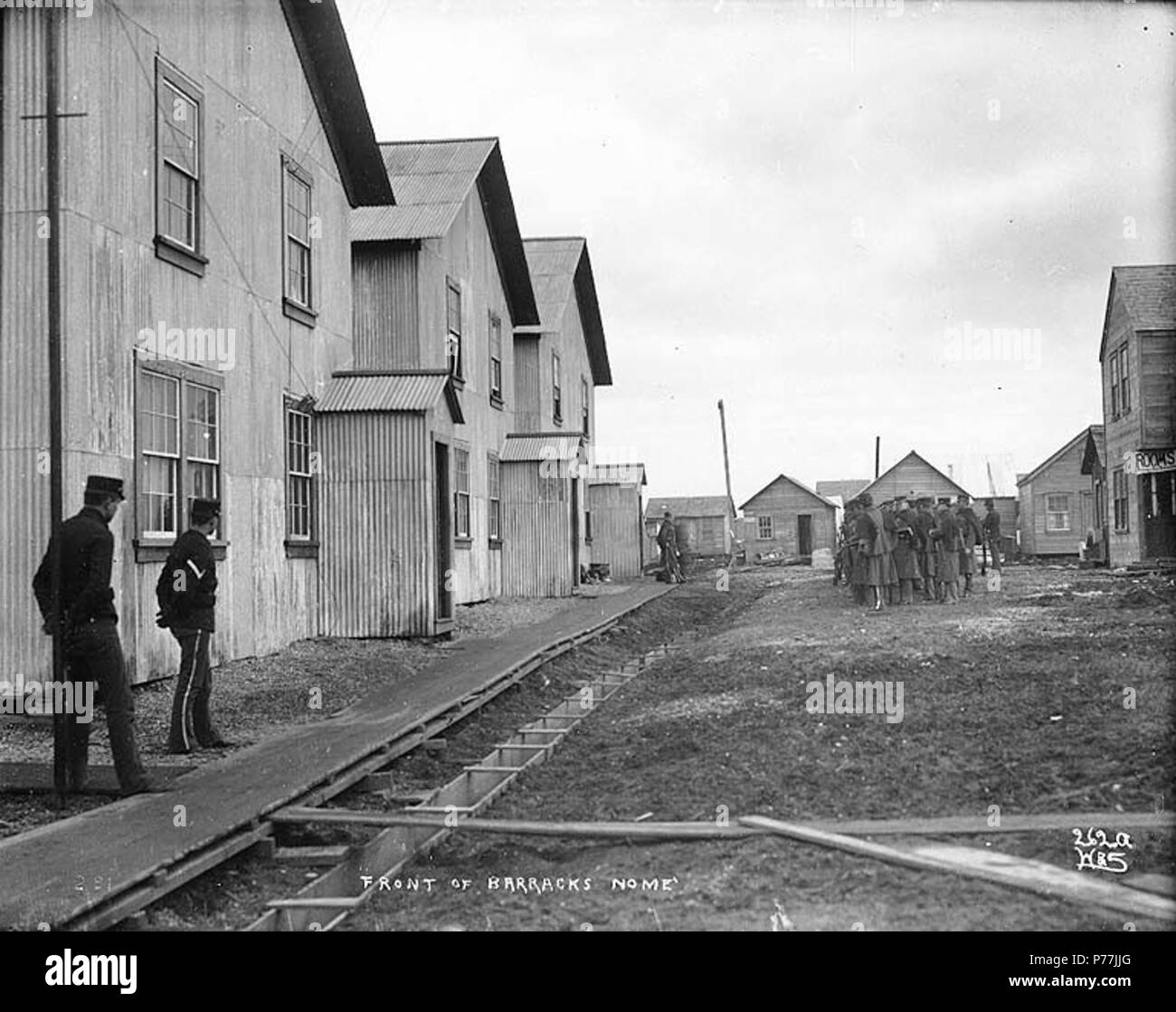 . English: Soldiers standing outside of U.S. Army barracks, Nome ...