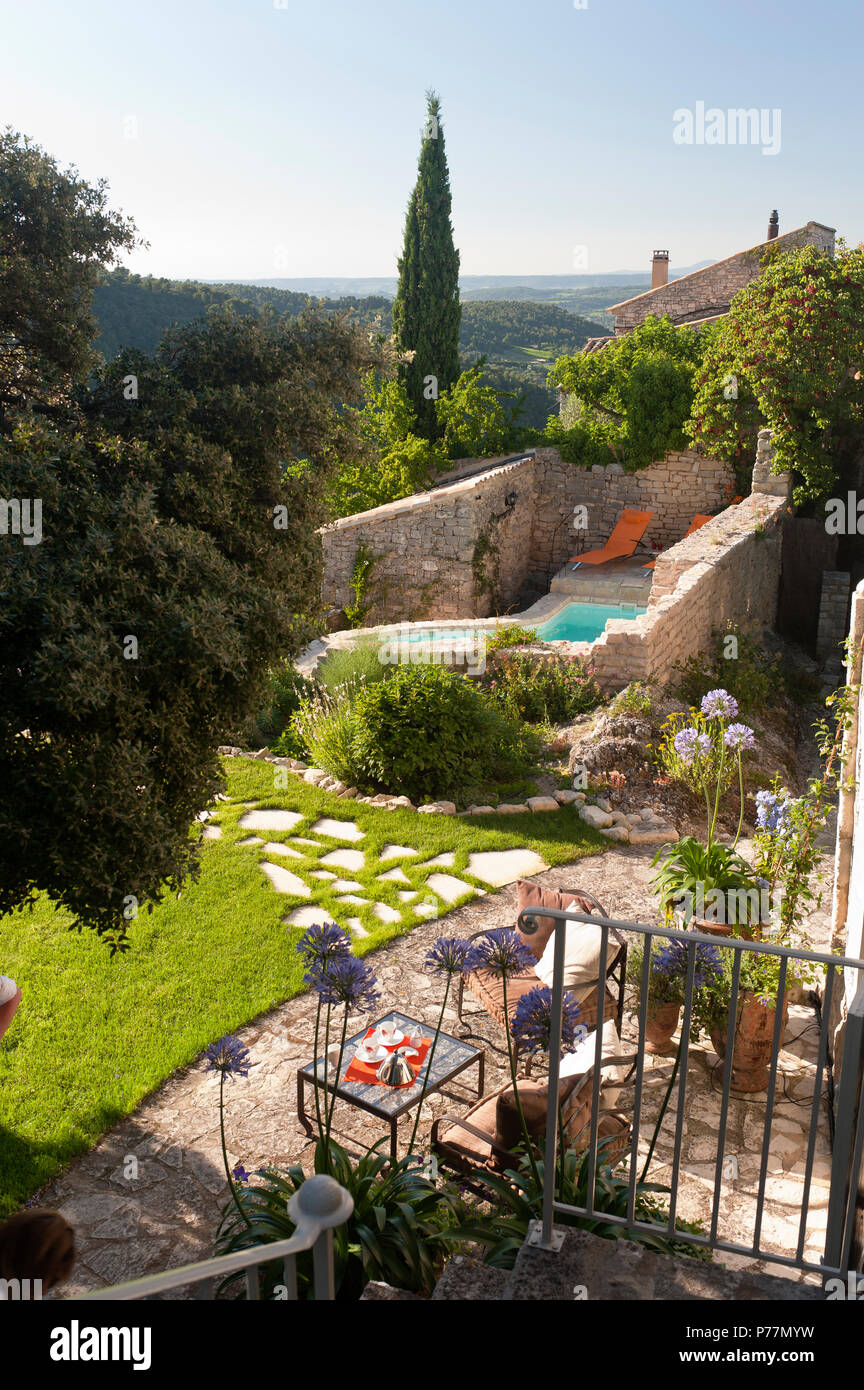 Rustic swimming pool and patio Stock Photo - Alamy