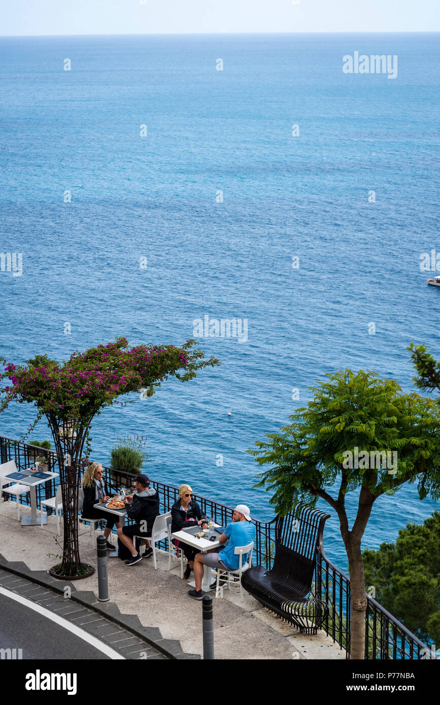 Positano, a cliffside village, Cafe along a road high above the sea ...