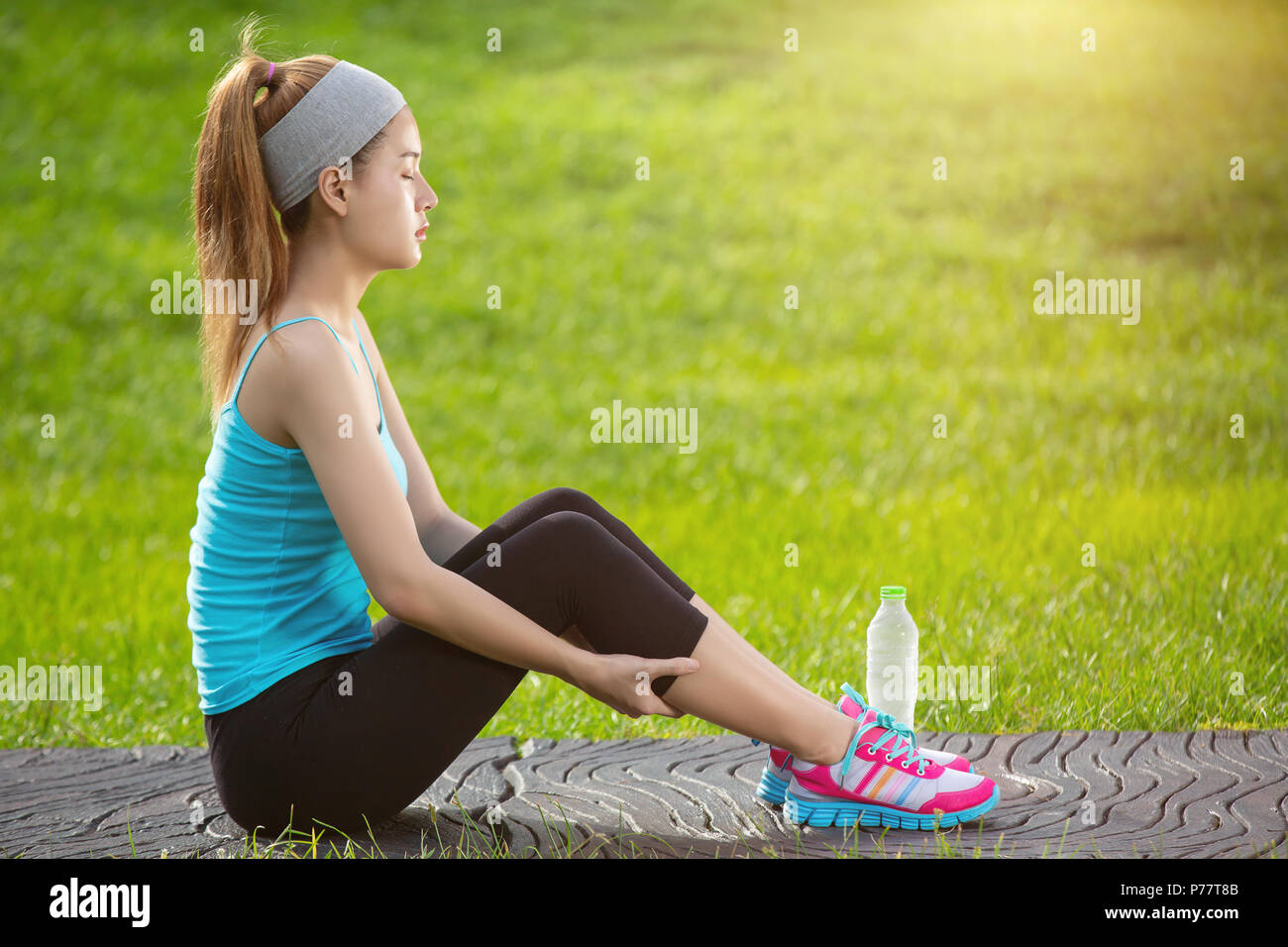 Exercise outdoor concept, Girl exercising in a park Stock Photo - Alamy