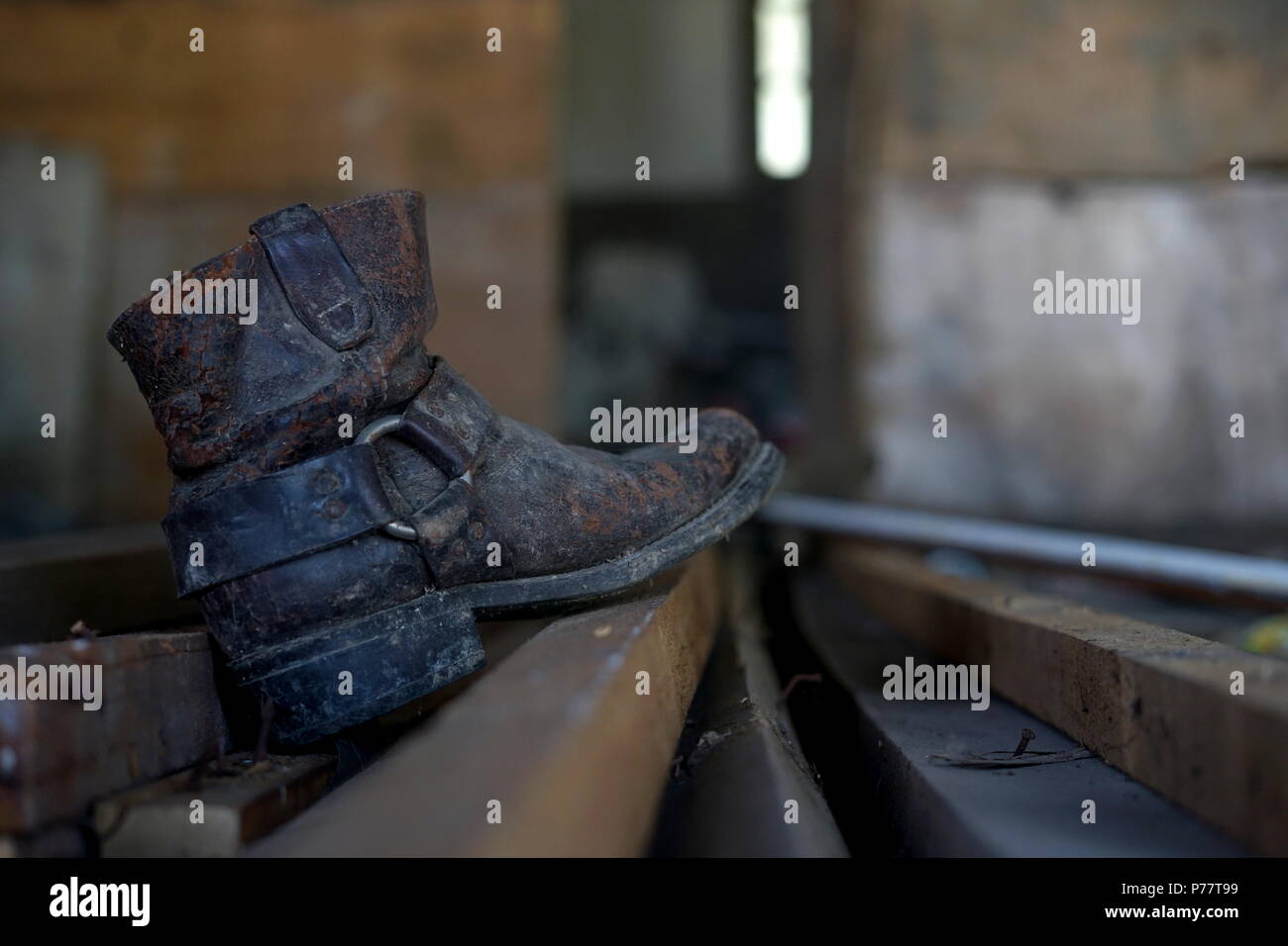 Old dusty vintage boot at abandoned building Stock Photo - Alamy
